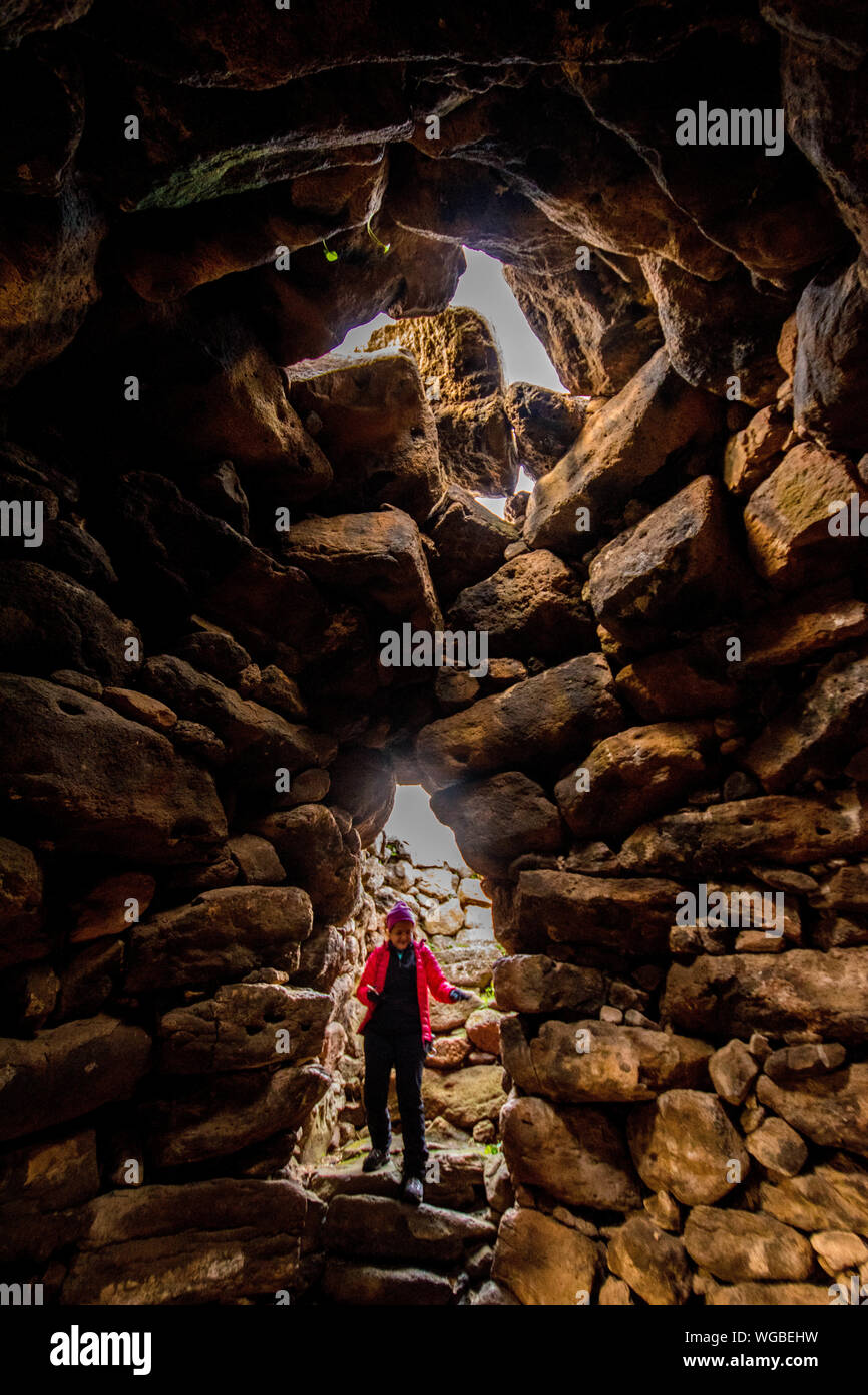 Woman walking in cave hi-res stock photography and images - Alamy