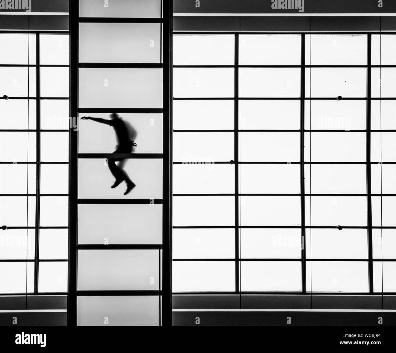 Man falling through window Black and White Stock Photos & Images - Alamy