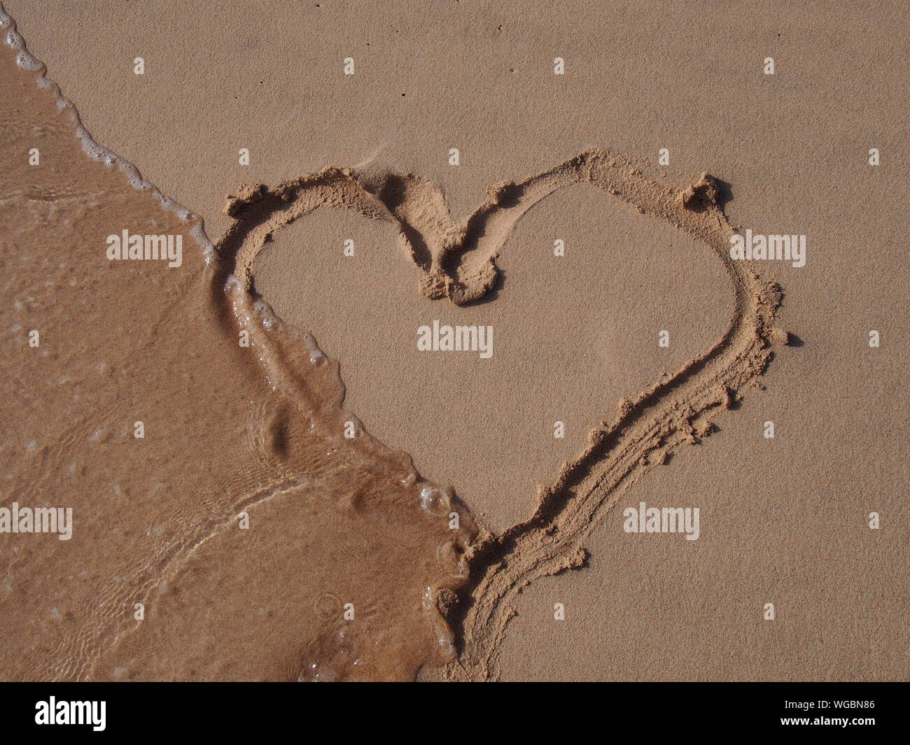 Heart Shape On Sand At Beach Stock Photo - Alamy