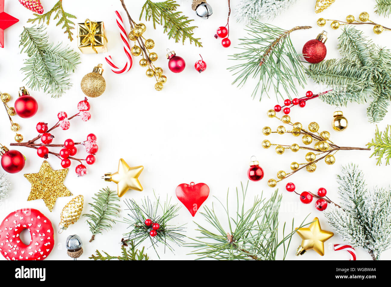 Christmas background border. Green fir branch, red holly berries ...