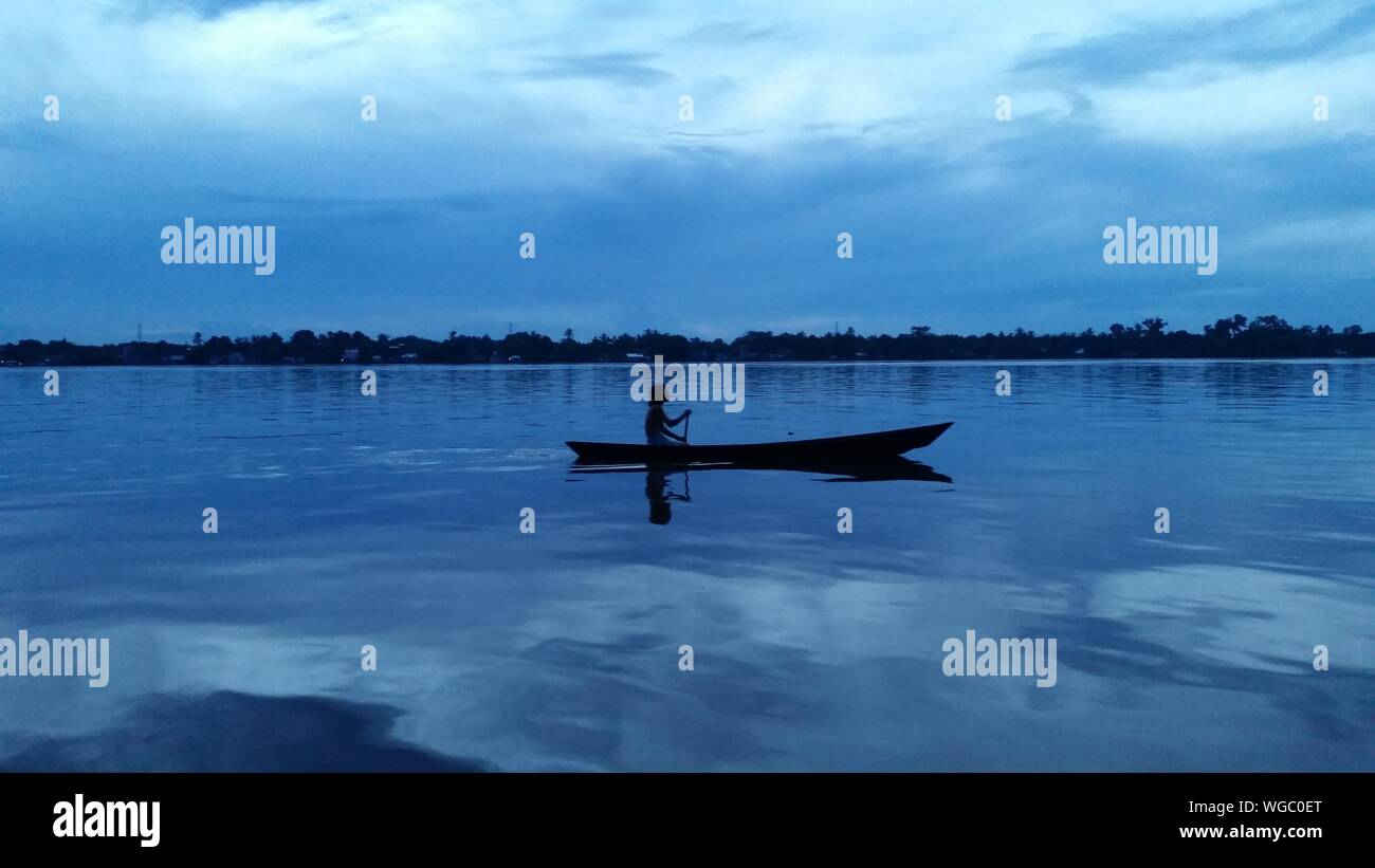 Man floating water silhouette hi-res stock photography and images - Alamy