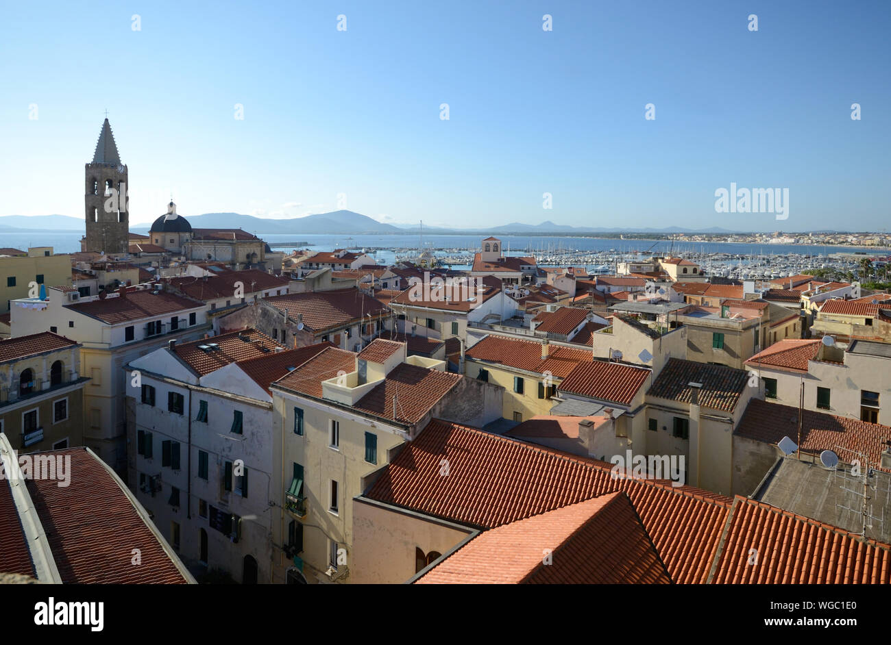 Aerial view of Alghero, city of Sardinia, with the bell tower of the ...