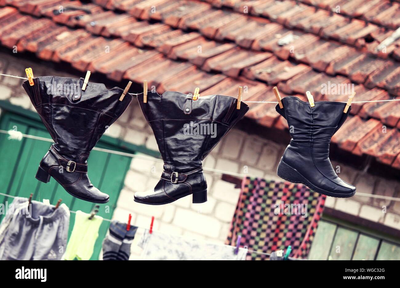 Hanging boots up hi-res stock photography and images - Alamy