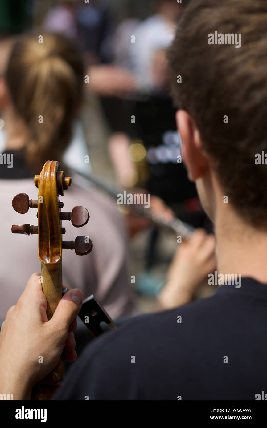 Violin orchestra from behind hi-res stock photography and images - Alamy