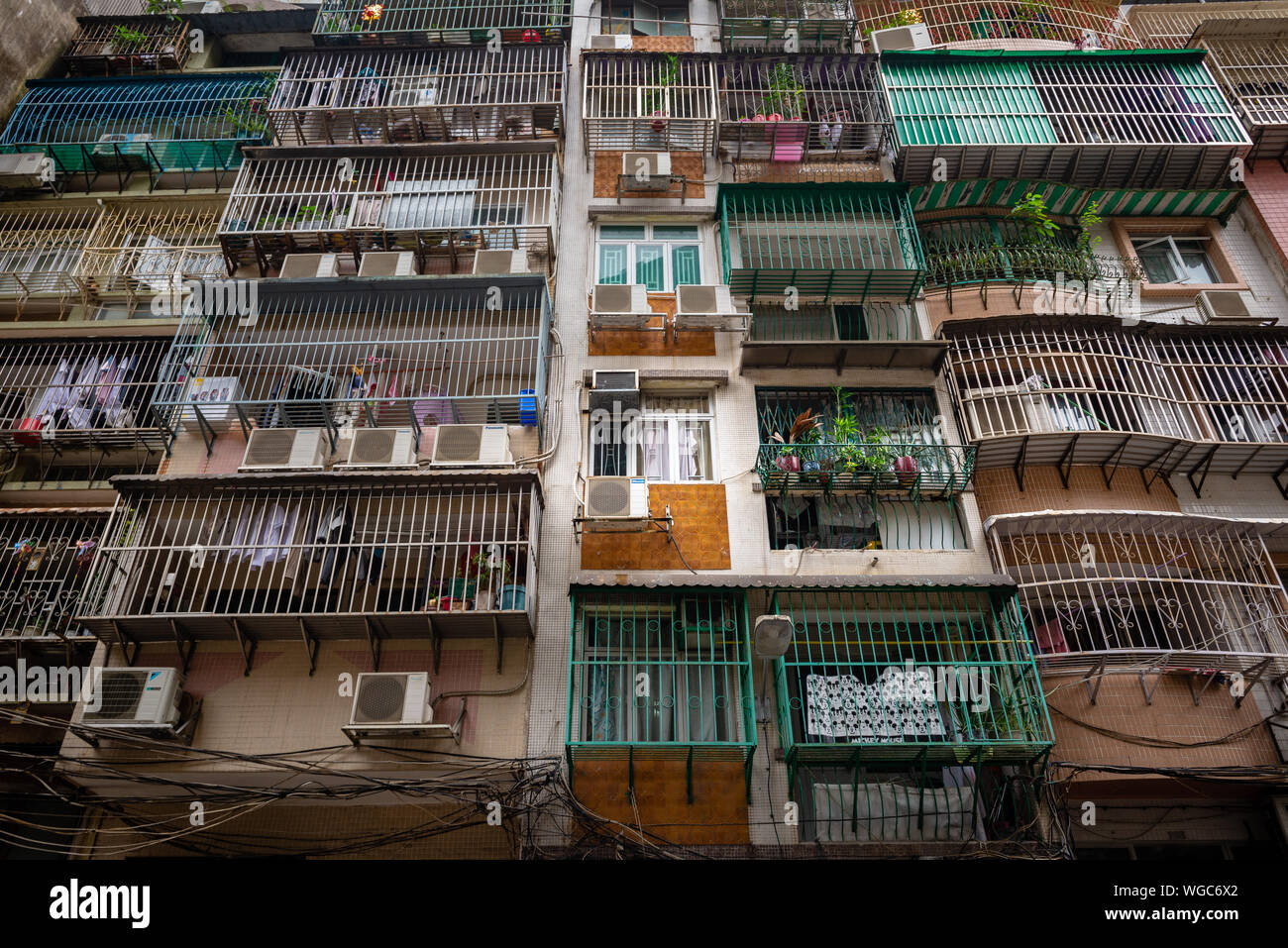 Facade of apartment building in Macau Stock Photo - Alamy