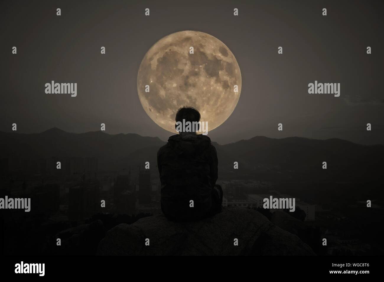 Man looking at moon hi-res stock photography and images - Alamy