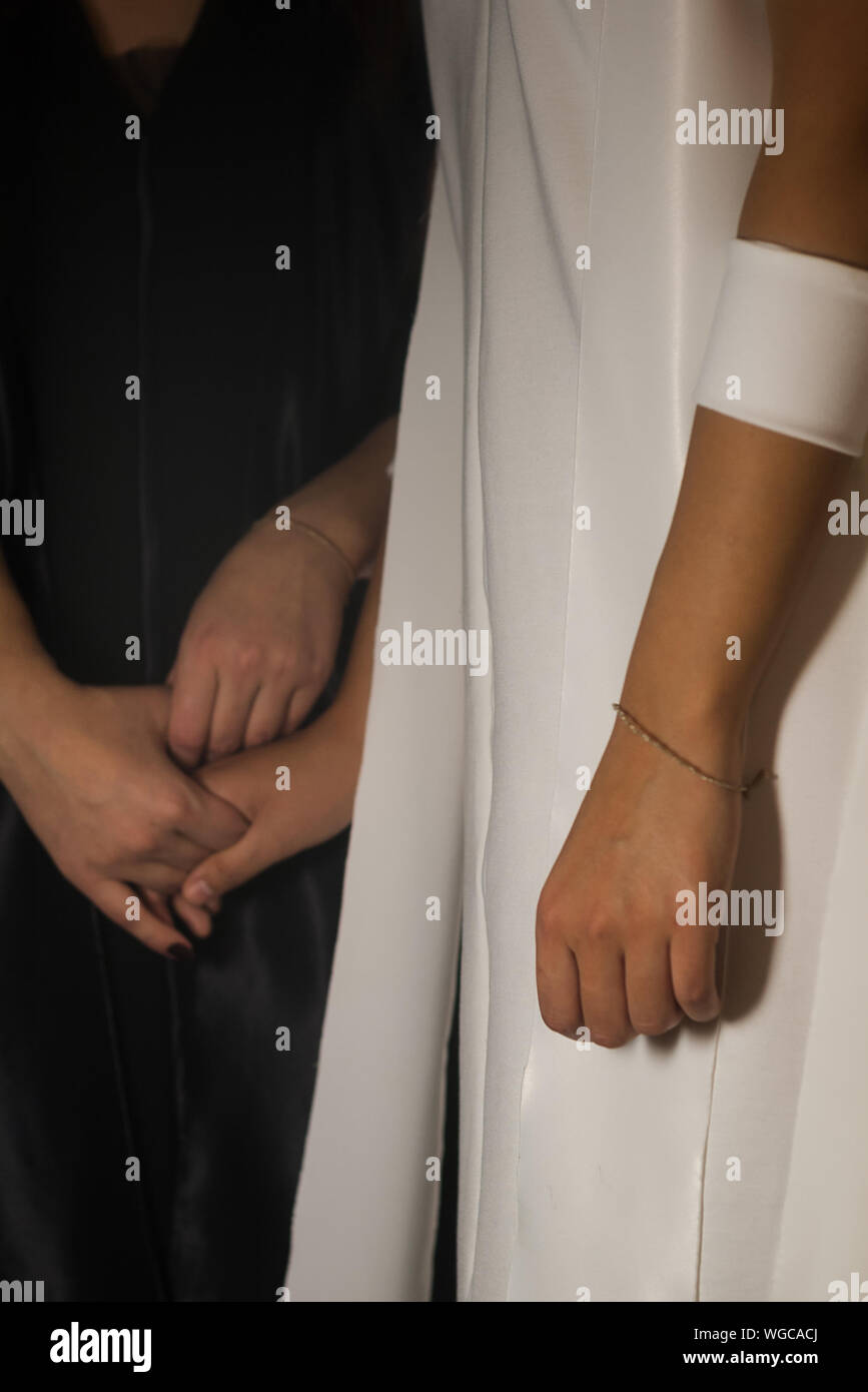 Two women hands holding hi-res stock photography and images - Alamy