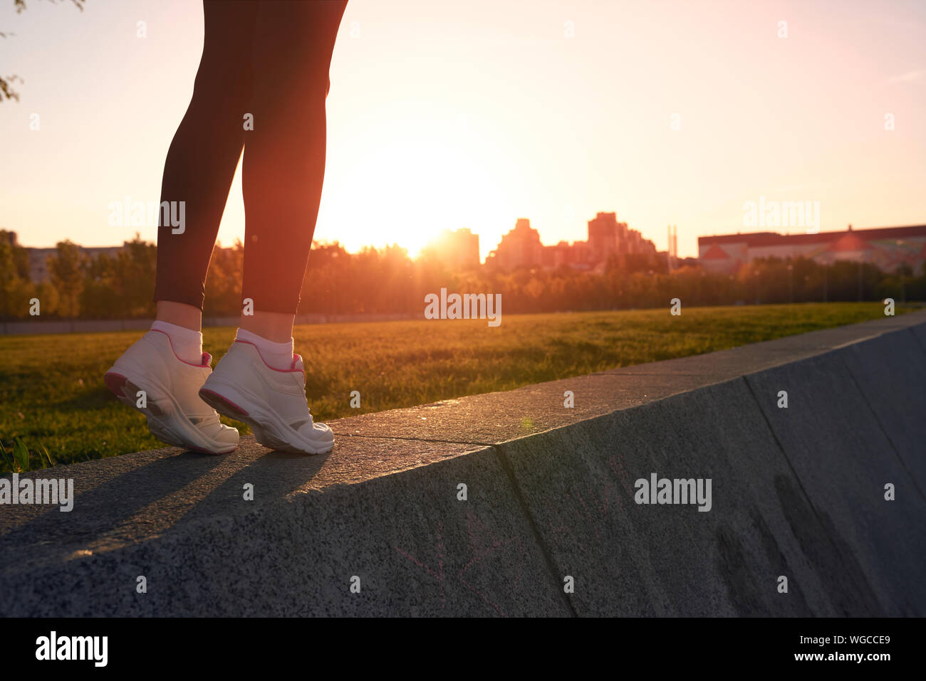 Close up of woman running shoes on sunset Stock Photo - Alamy