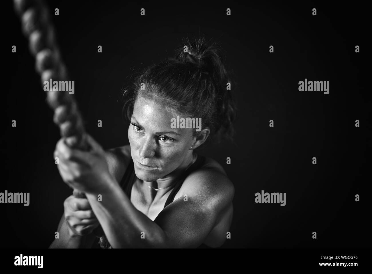 Woman pulling rope hi-res stock photography and images - Alamy