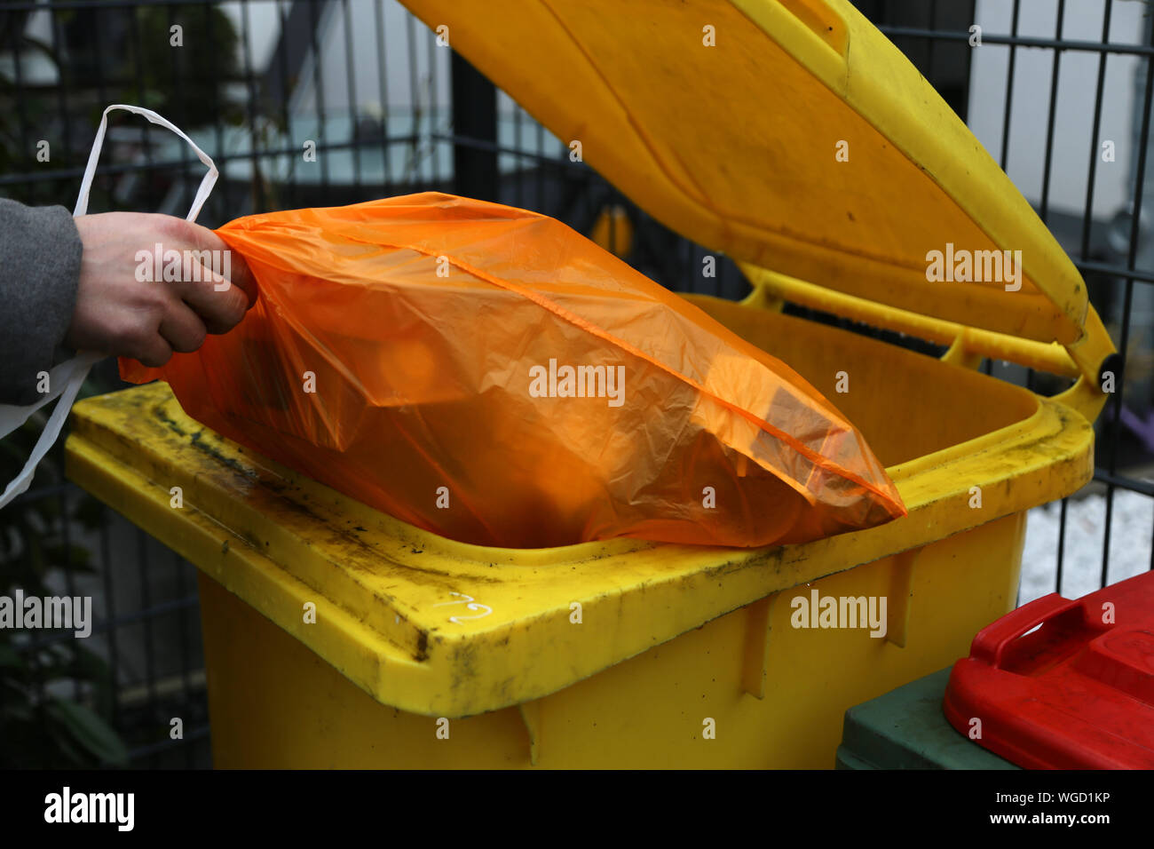 Orange garbage bin hi-res stock photography and images - Alamy
