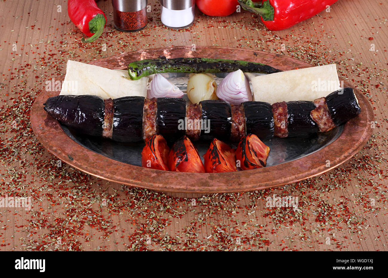 Roast meat and eggplant with tomatoes and onions in a high-angle copper ...