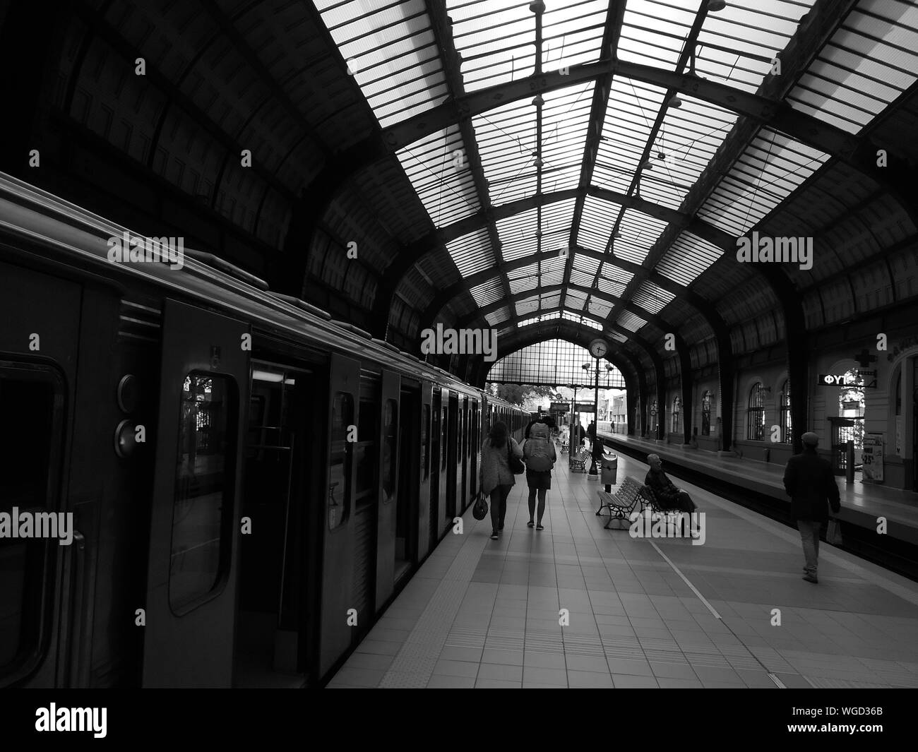 Station with people on platform Black and White Stock Photos & Images ...