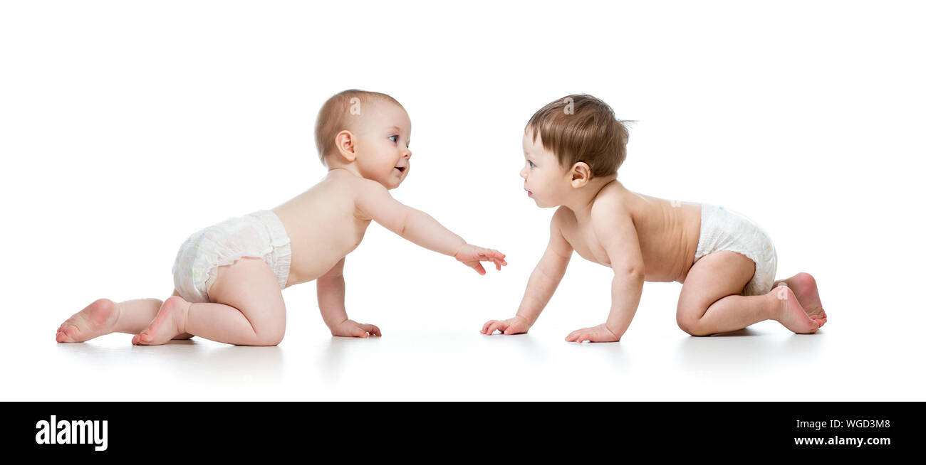 Two cute children looking at each other. Babies weared diaper. Infants ...