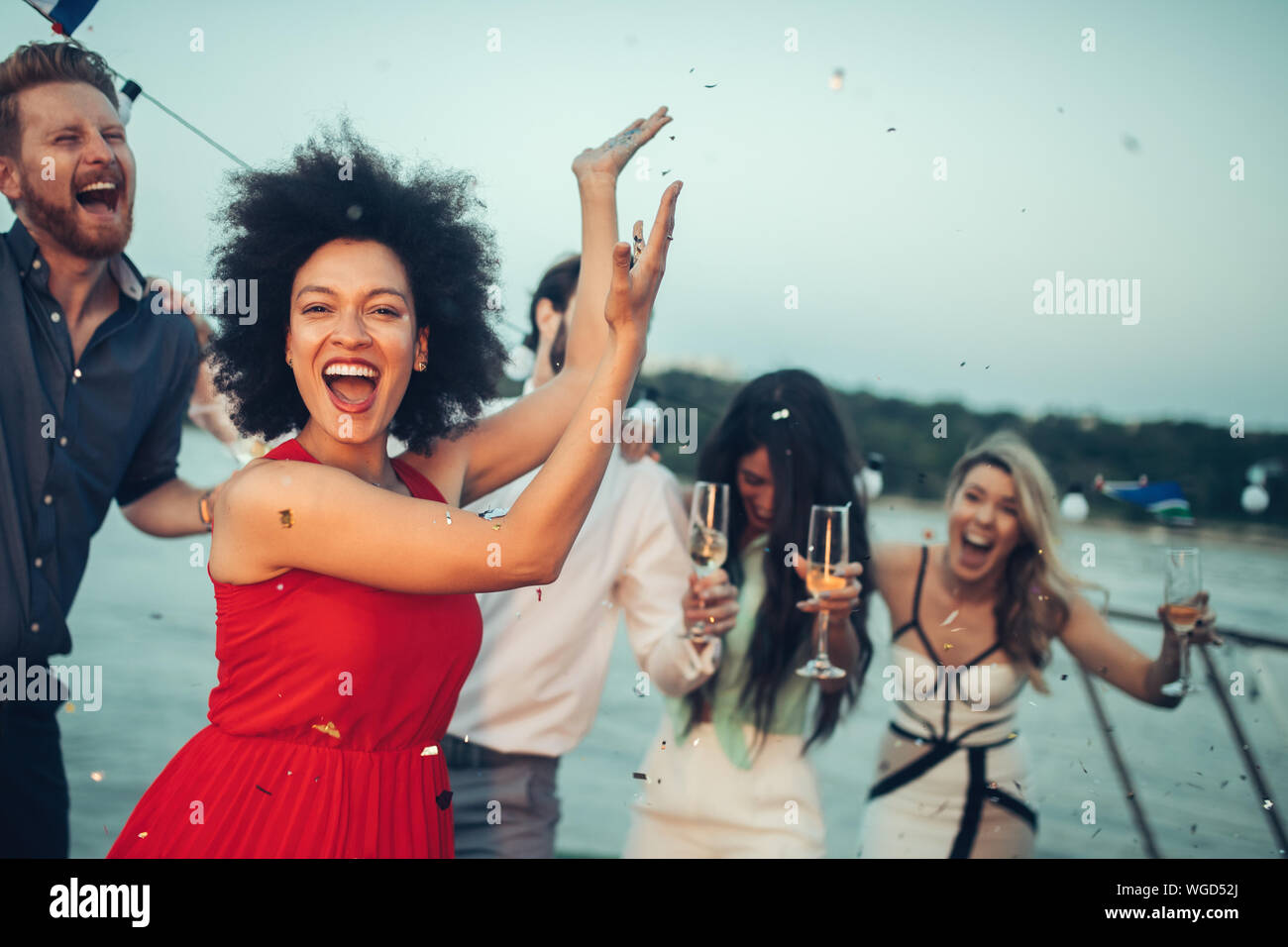 Group of friends at party dancing and smiling together Stock Photo - Alamy