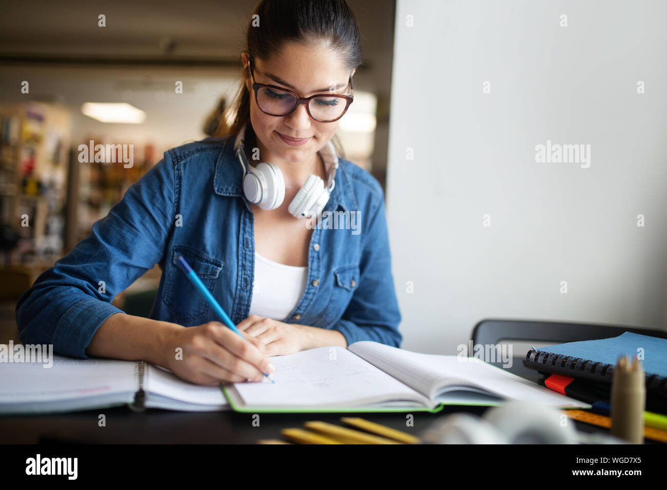 Beautiful student woman studying and learning at college Stock Photo ...