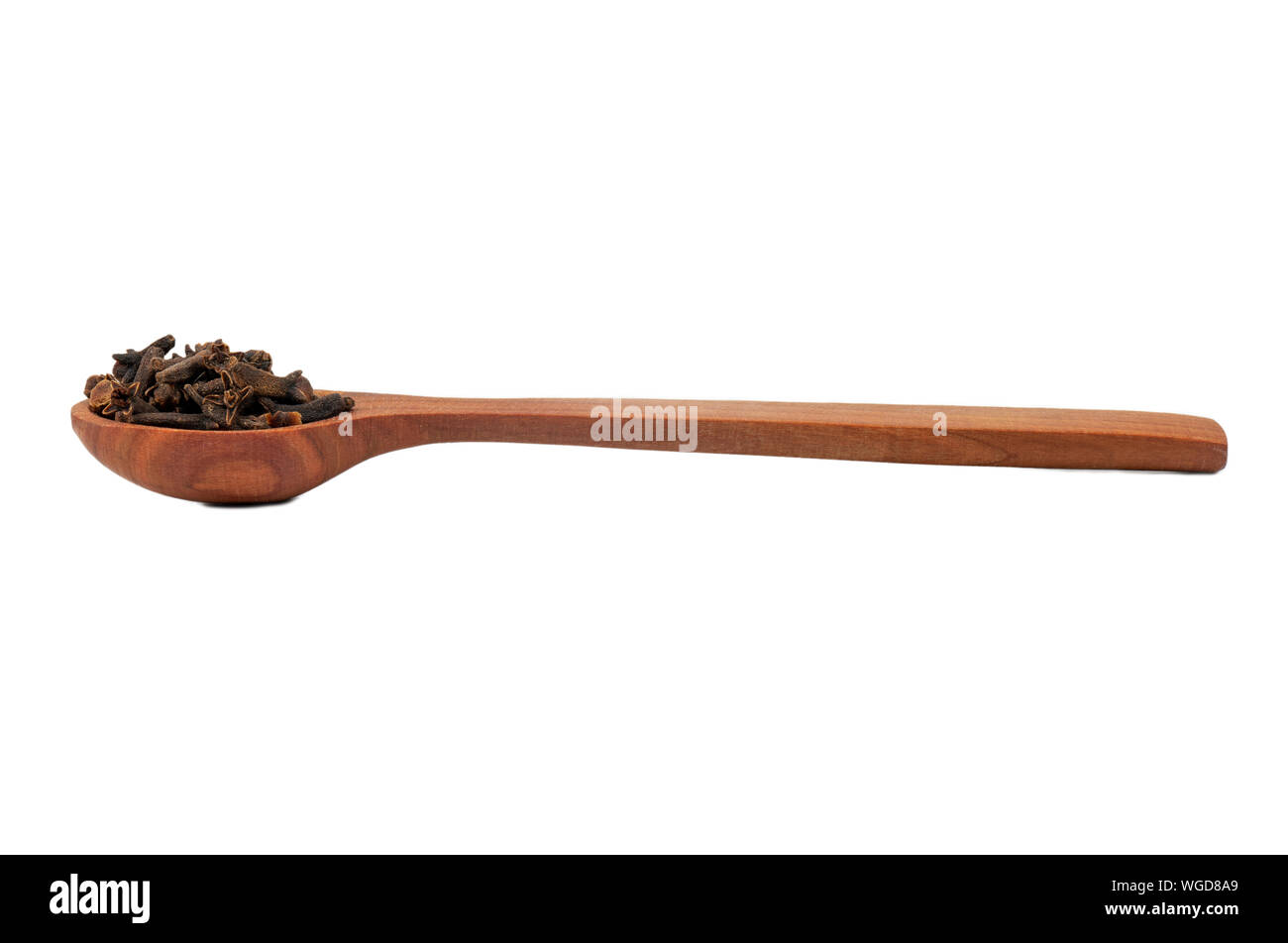 Whole cloves in wooden spoon hi-res stock photography and images - Alamy