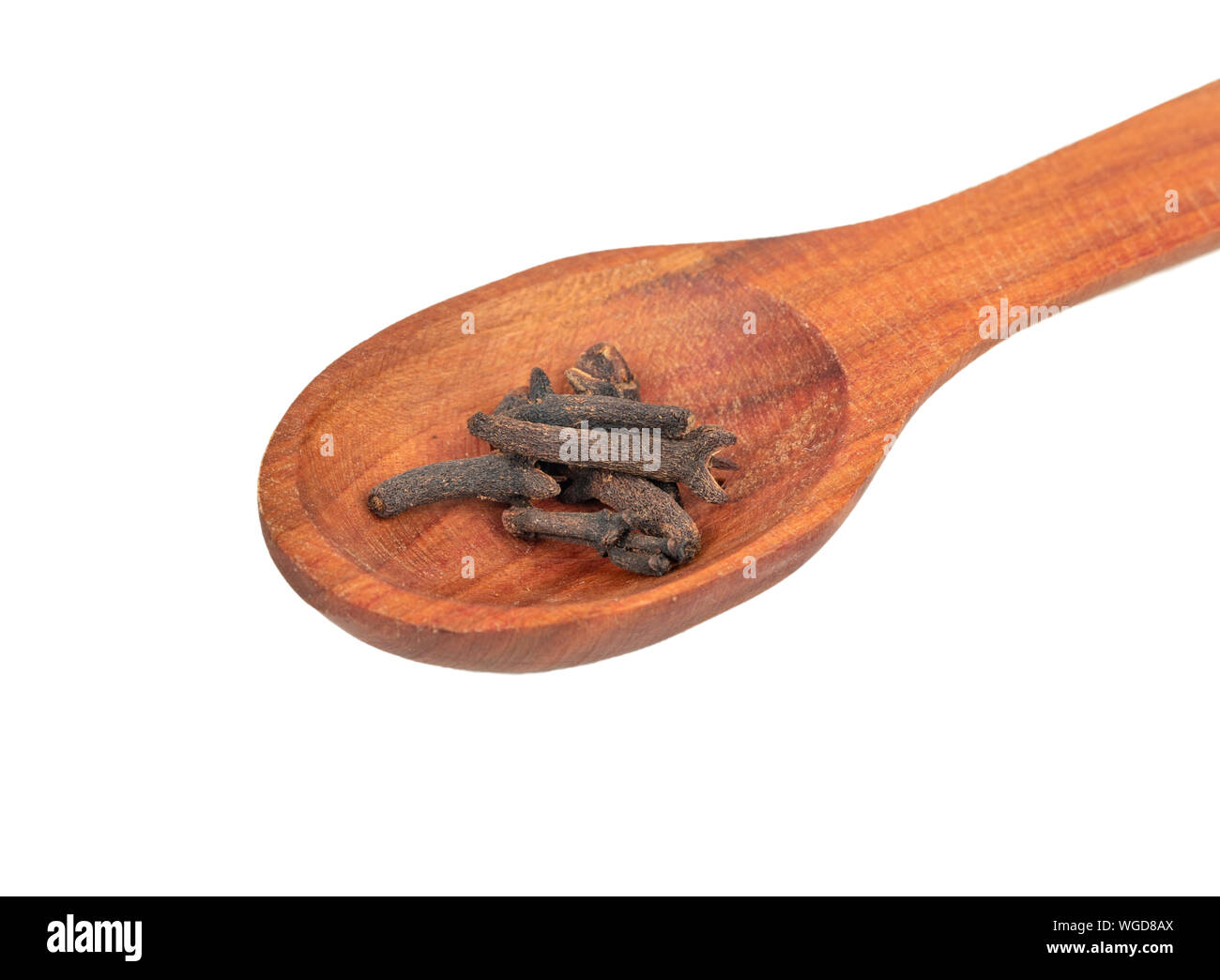 Dry cloves in wooden spoon isolated on white background closeup Stock ...
