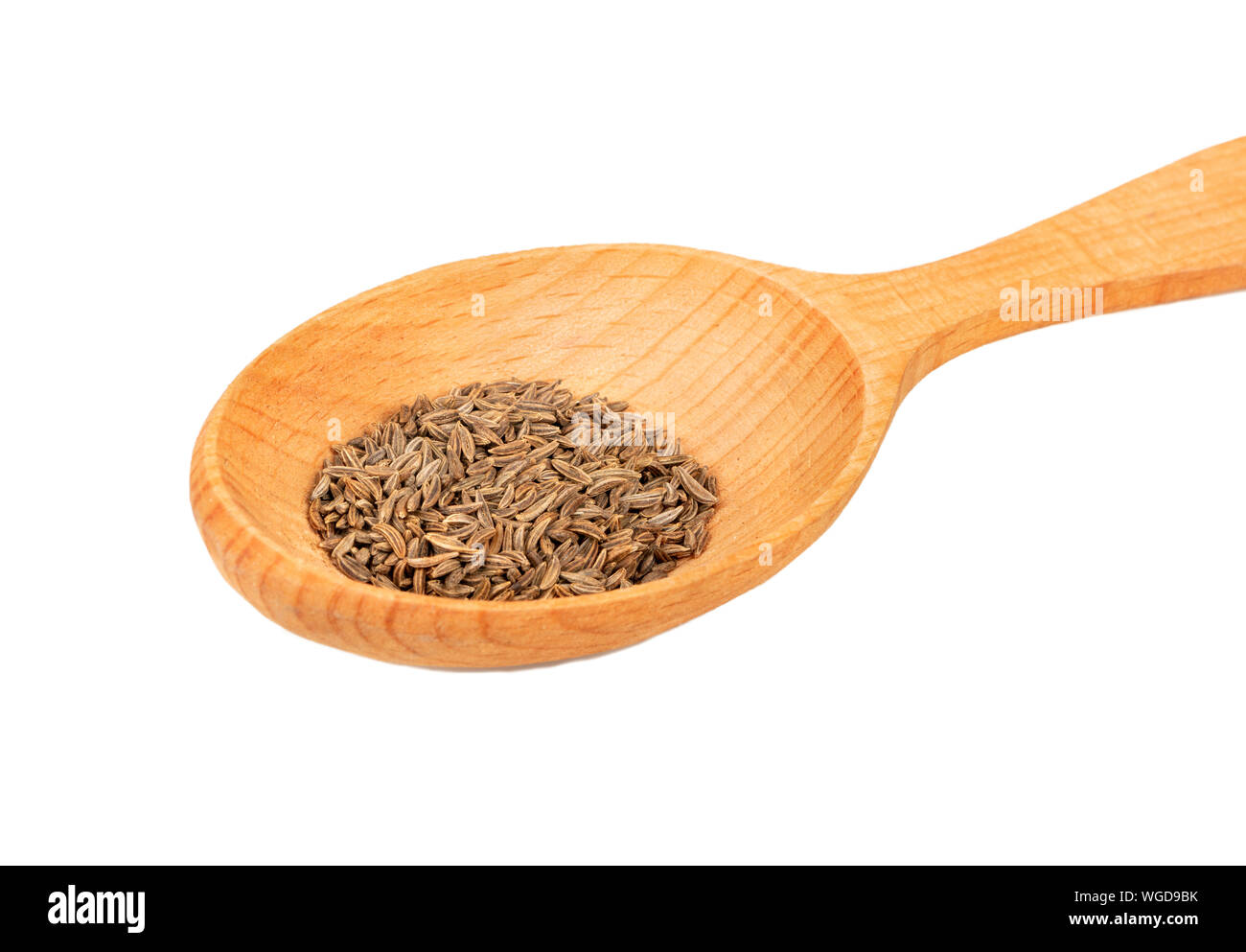 Wooden spoon with dry cumin closeup isolated on white background Stock ...