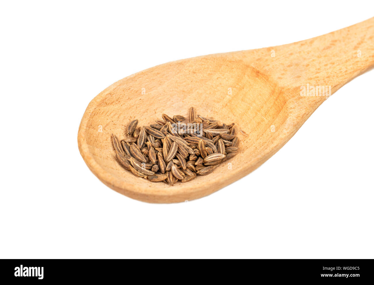 Dry cumin seeds in spoon closeup on white background Stock Photo - Alamy