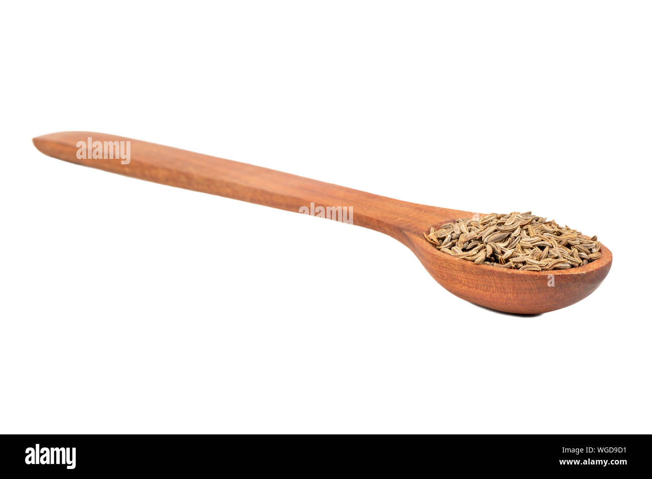 Spice dry cumin in wooden spoon closeup on white background Stock Photo ...