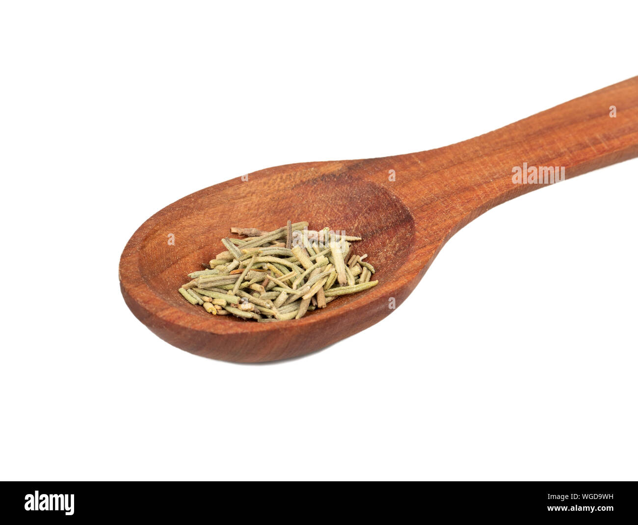 Dry rosemary in wooden spoon closeup isolated on white background Stock ...