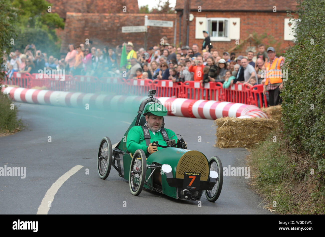 A competitor steers the 'Toad on the Road' kart downhill during the ...
