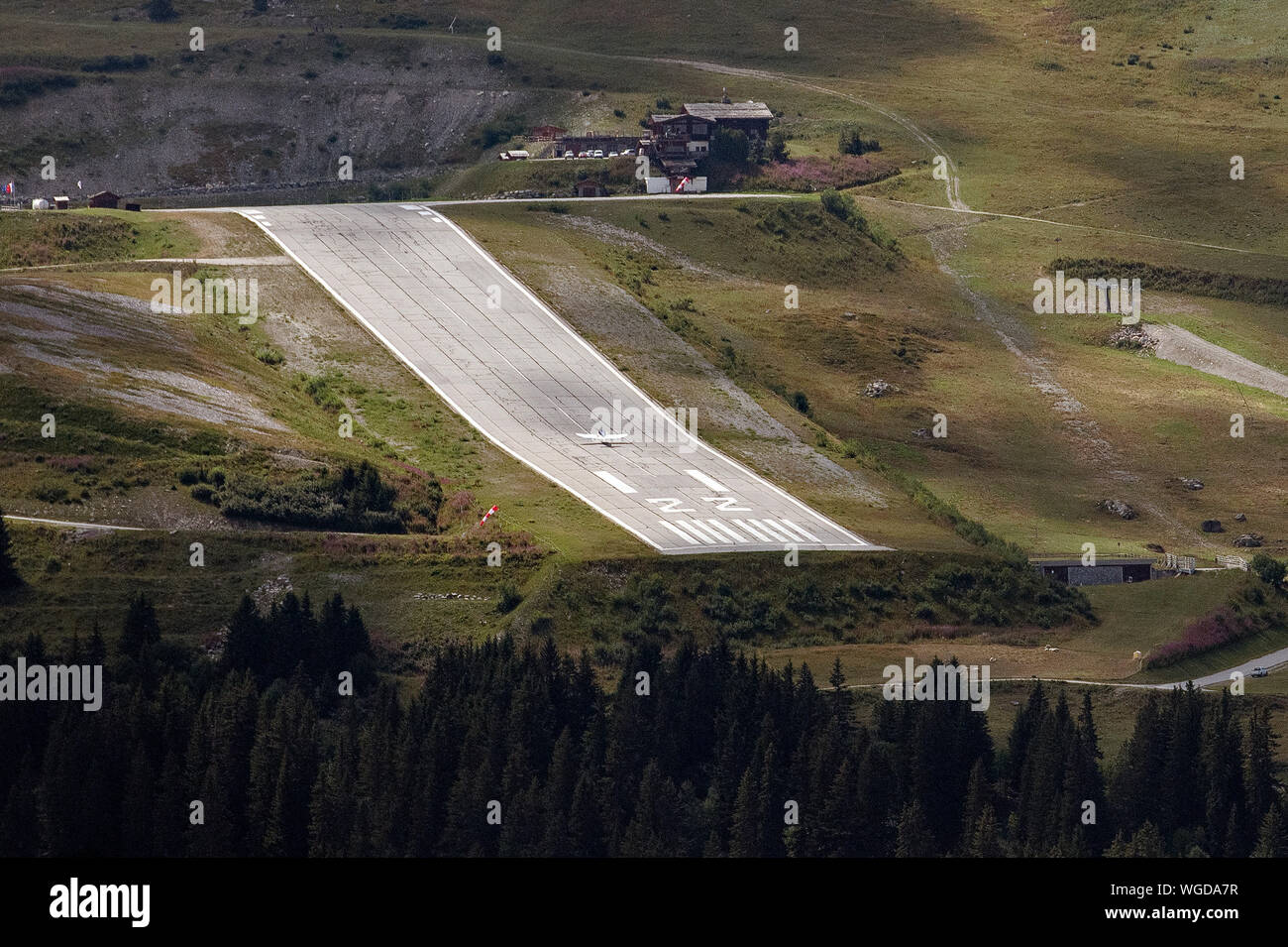 A light aircraft comes into land at Courchevel Altiport (French ...