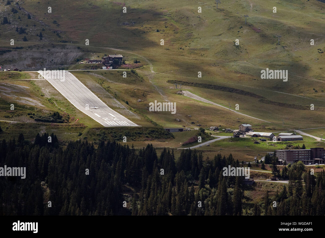 A light aircraft comes into land at Courchevel Altiport (French ...
