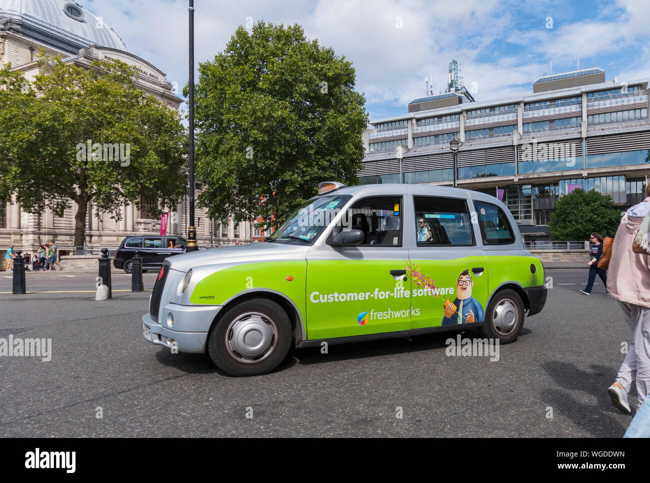 Green & Silver LTI TX4 taxicab with advertising in the City of ...