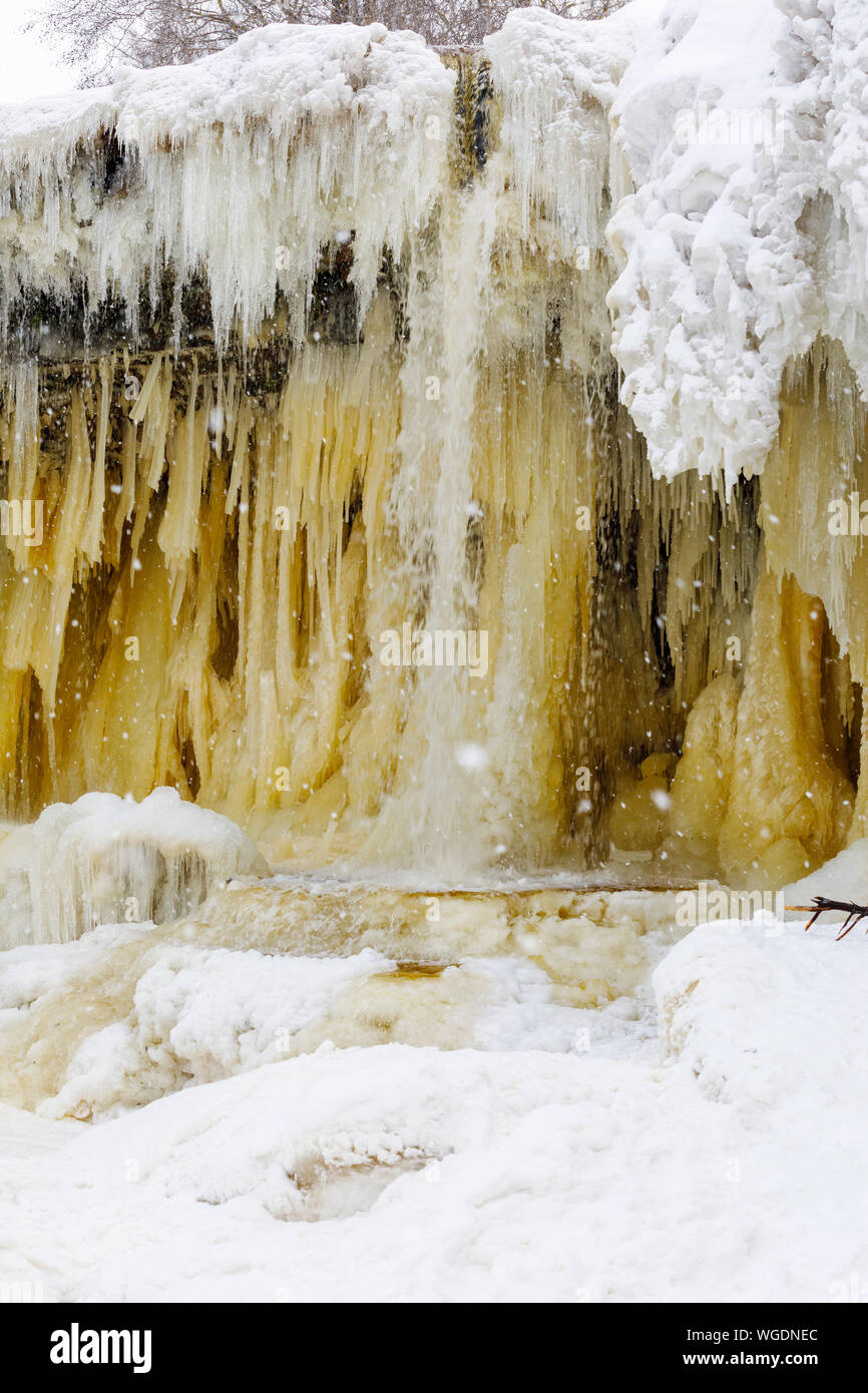 Icicles at frozen waterfall and stream of falling water Stock Photo - Alamy
