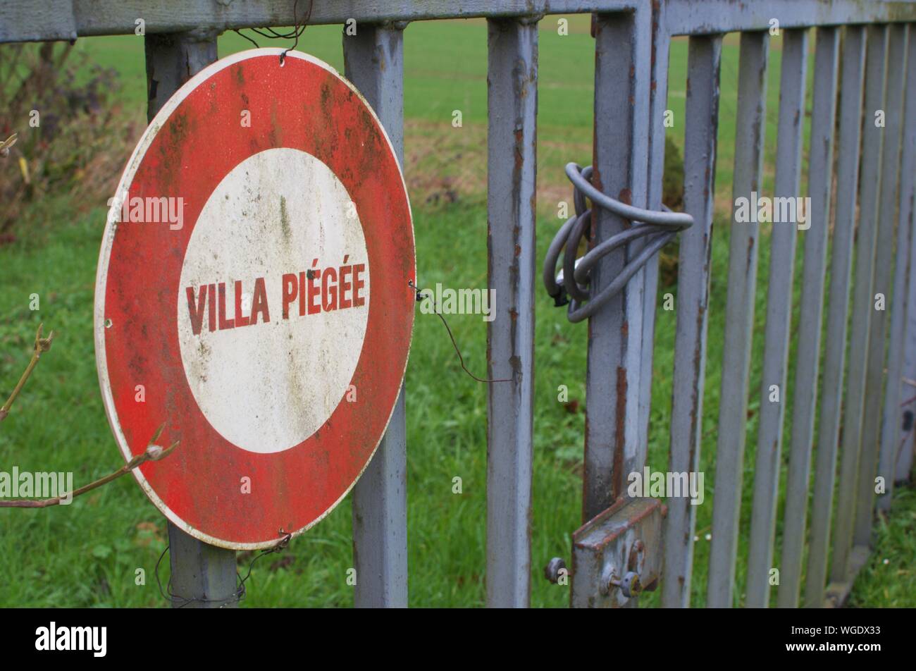 Metal gate with red sign hi-res stock photography and images - Alamy