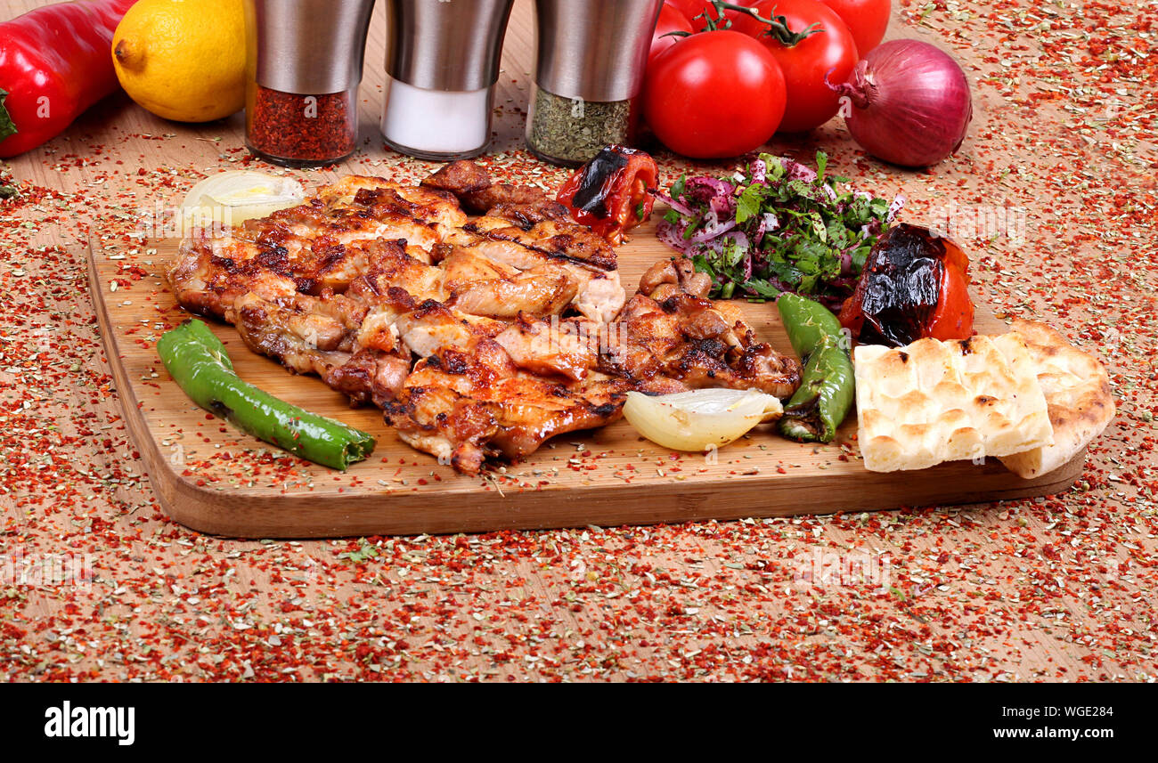 Grilled Chicken Serving on White Plate with Fresh Pepper and Salad with ...