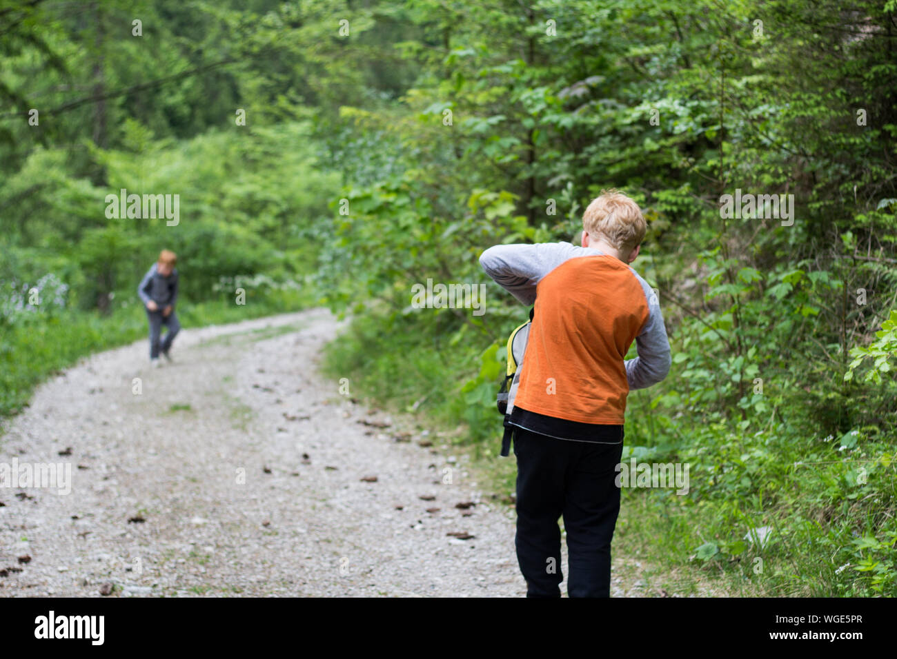 Boys walking hi-res stock photography and images - Alamy