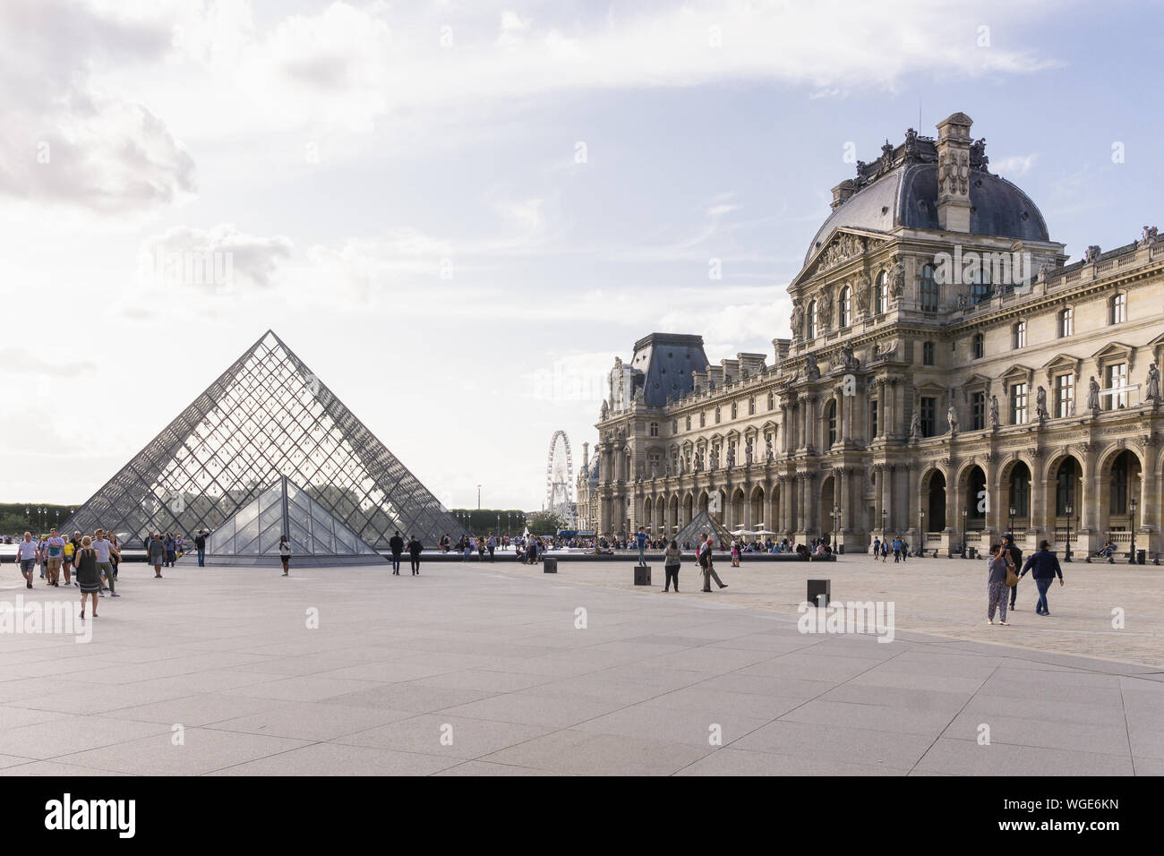 Paris Louvre - building of the Louvre museum and a glass pyramid in ...