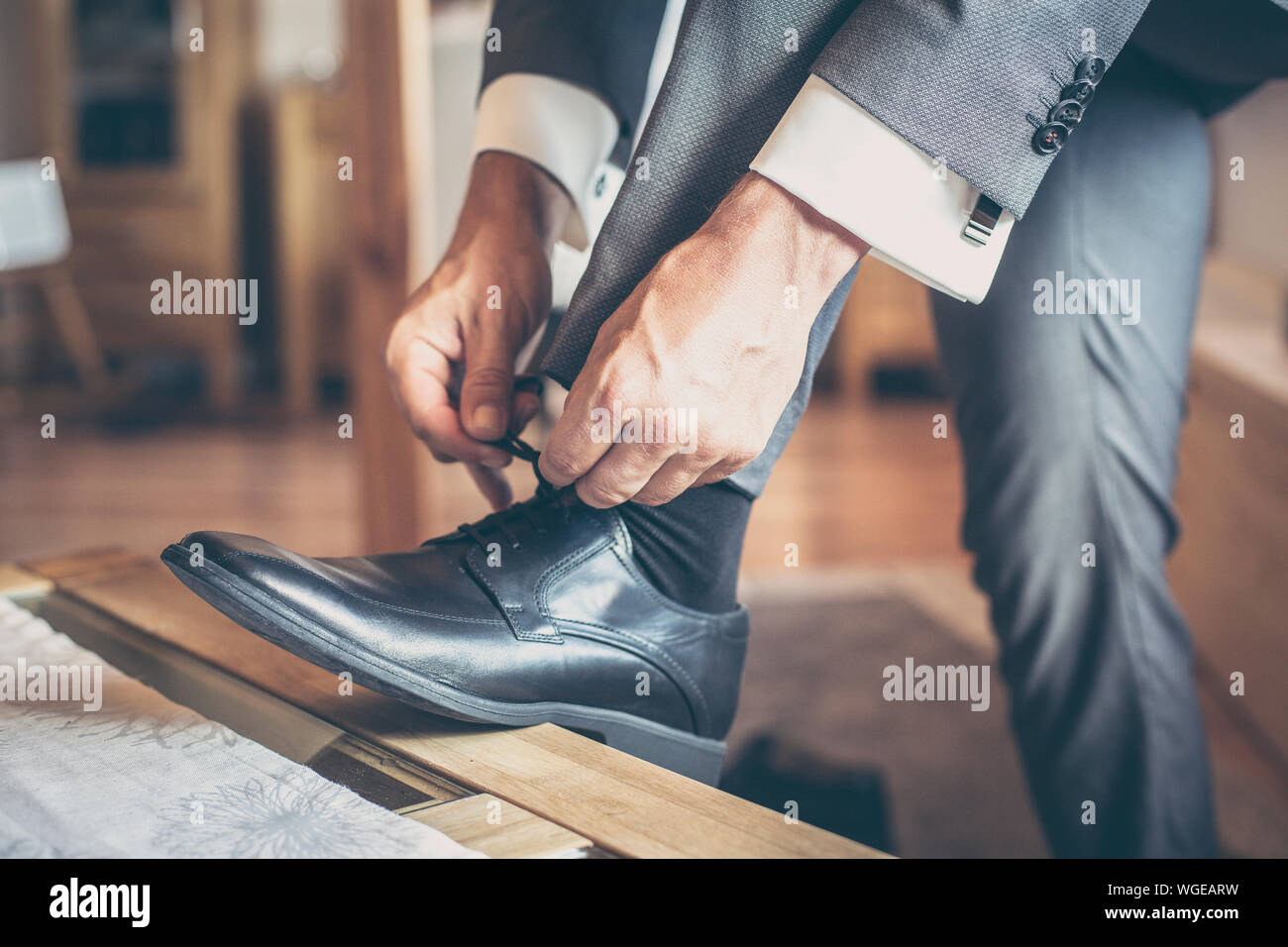 Tying shoes hi-res stock photography and images - Alamy