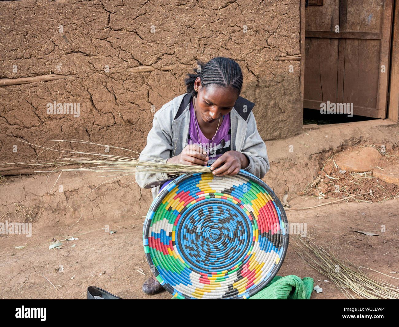 OROMIA, ETHIOPIA-NOVEMBER 5, 2014: An unidentified woman makes a ...