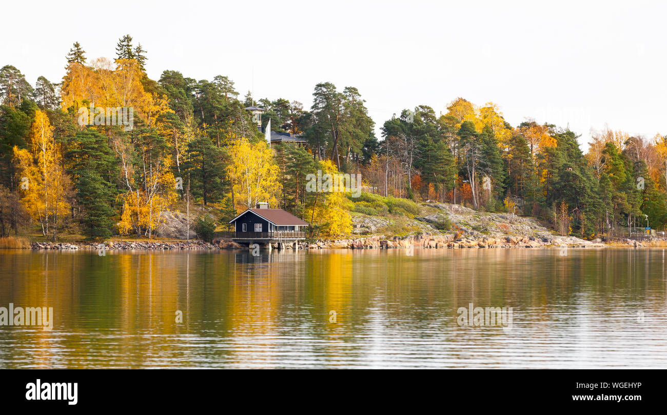 Colorful autumn forest beside a water side Stock Photo - Alamy