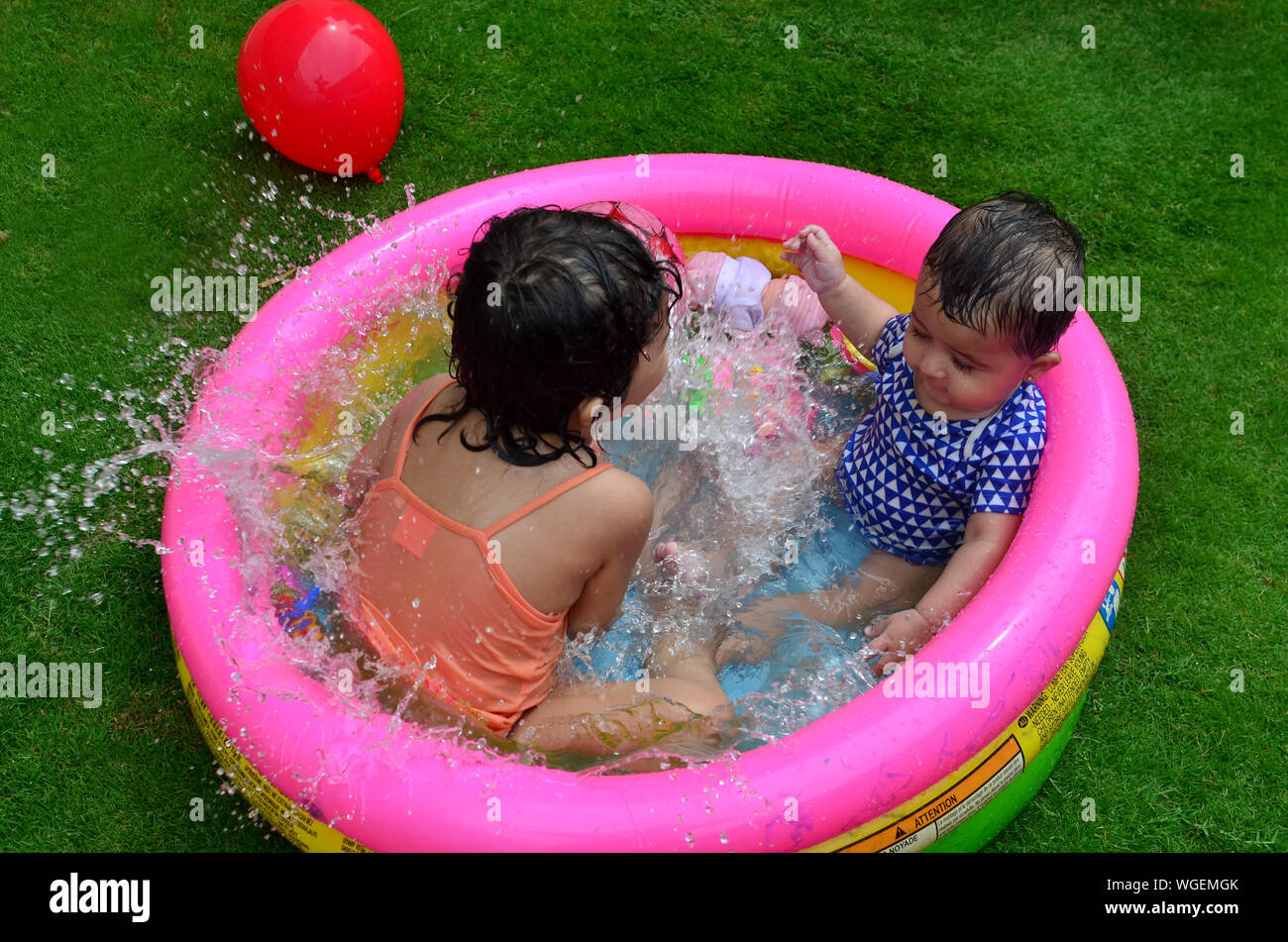 Children playing swimming pool hi-res stock photography and images - Alamy