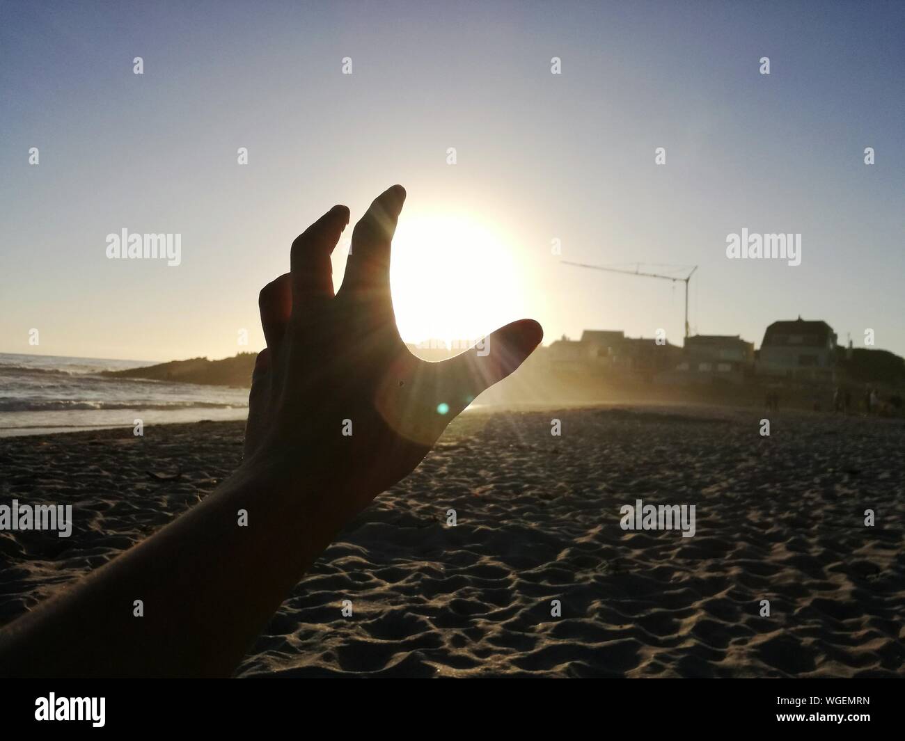 Optical illusion hand holding sun hi-res stock photography and images ...