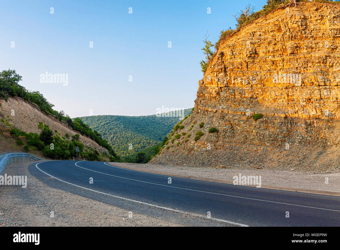 summer landscape mountain road with a sharp turn and descent Stock ...