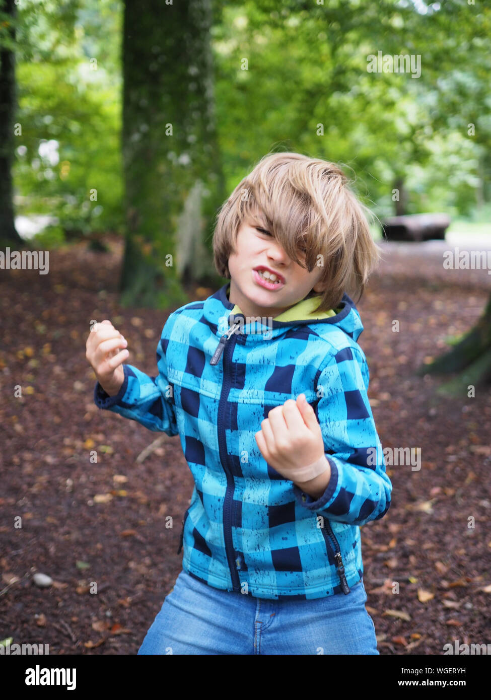 Boy standing sad hi-res stock photography and images - Alamy