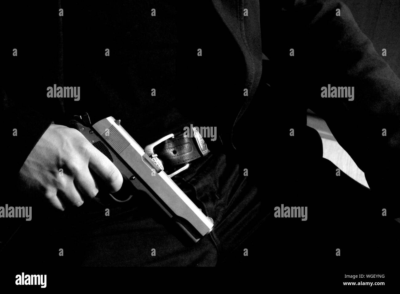Man holding pistol hi-res stock photography and images - Alamy