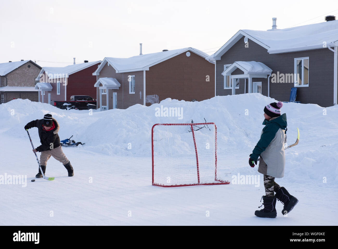 Native kids playing hockey hi-res stock photography and images - Alamy