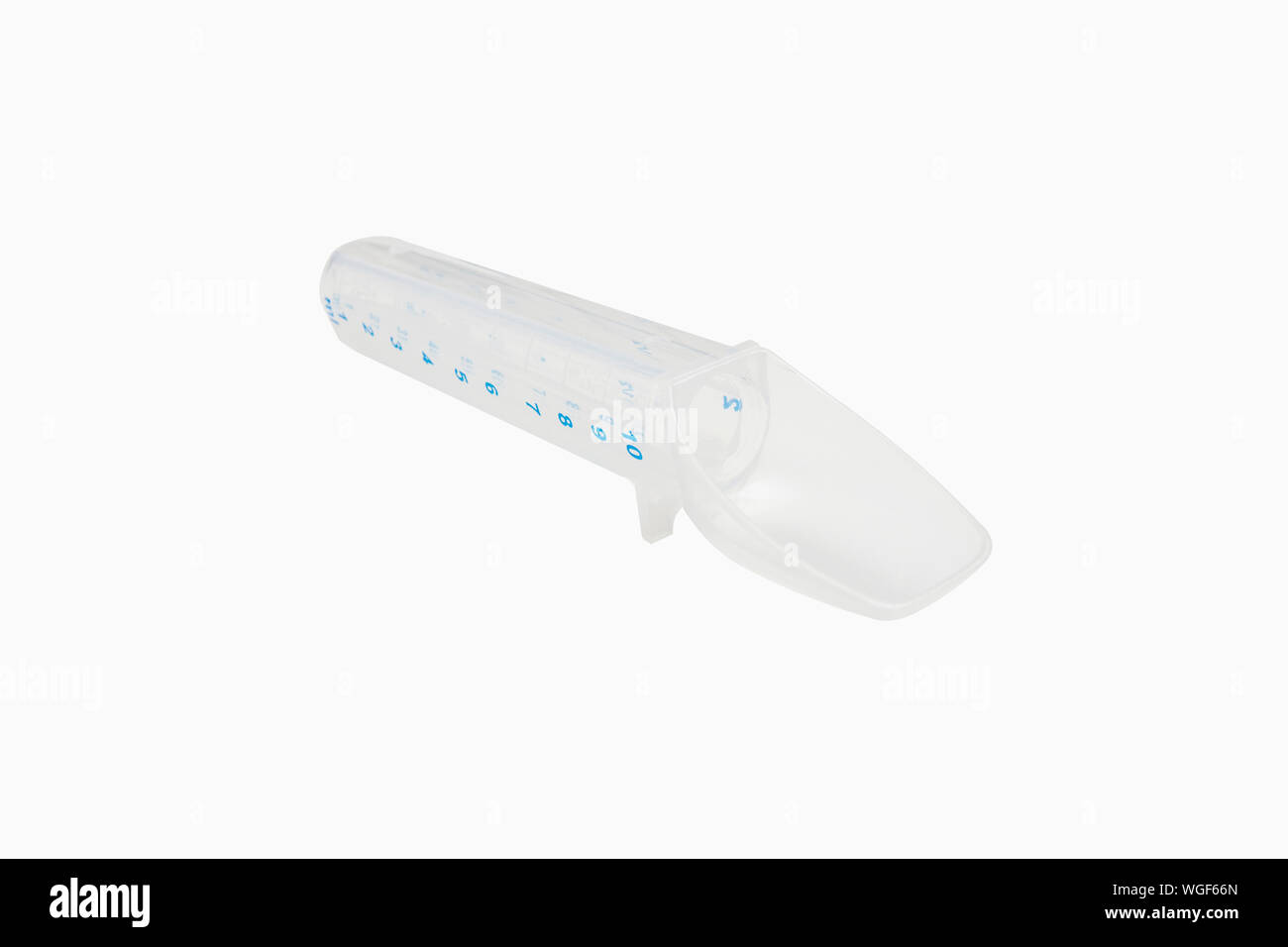 Medicine dosing spoon on white background Stock Photo - Alamy