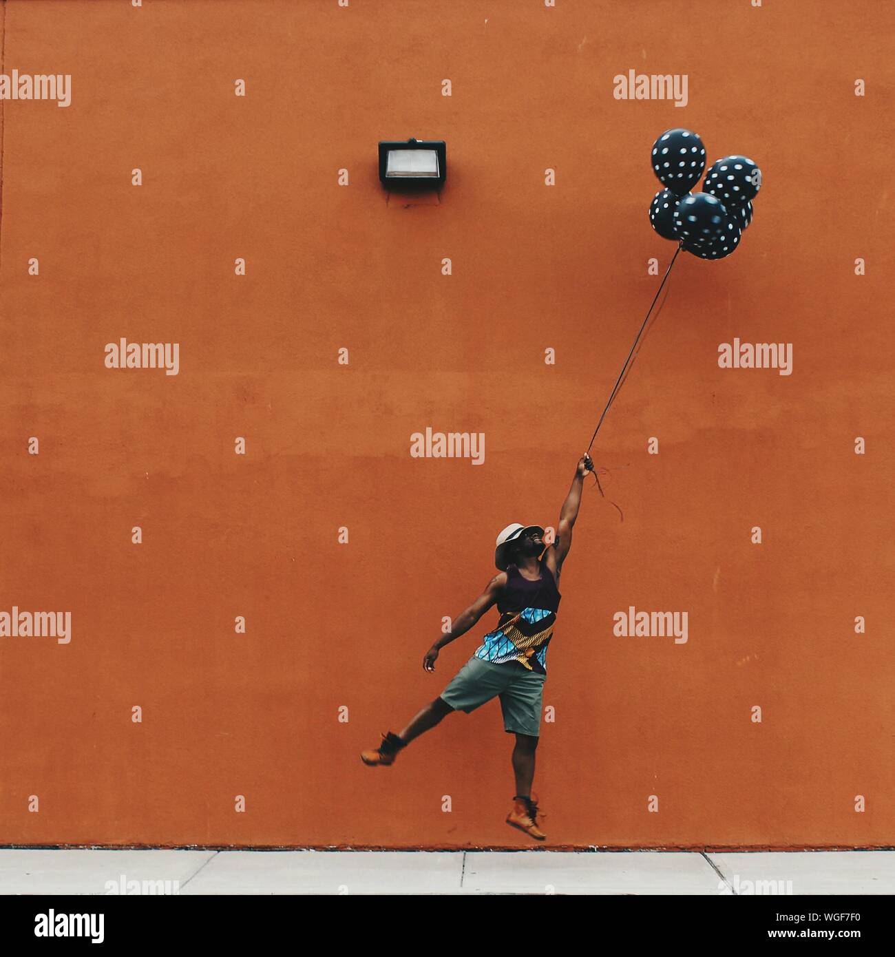 Man Flying Balloons High Resolution Stock Photography and Images - Alamy