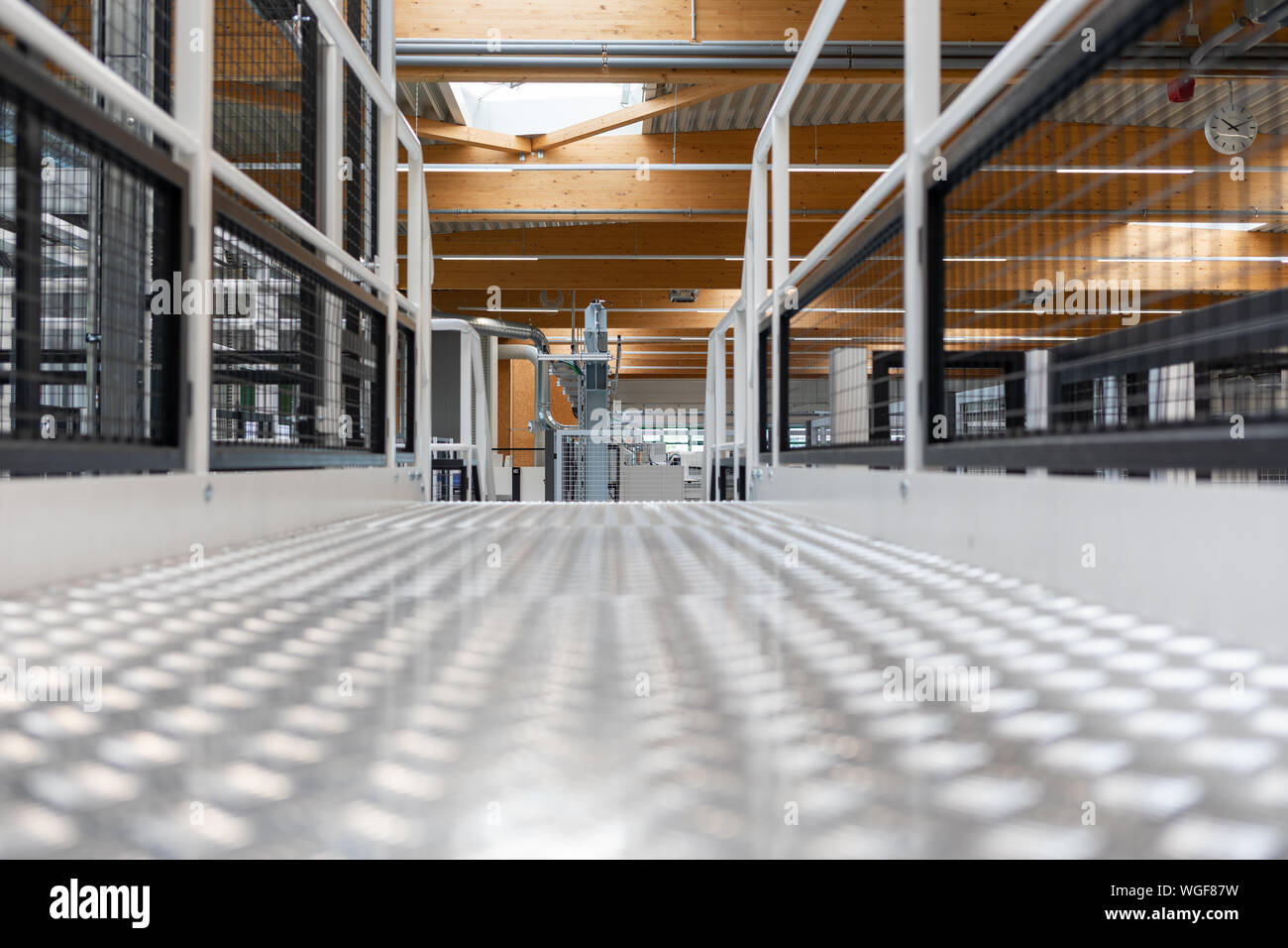 A metal floor and stairs are located in a factory hall Stock Photo - Alamy