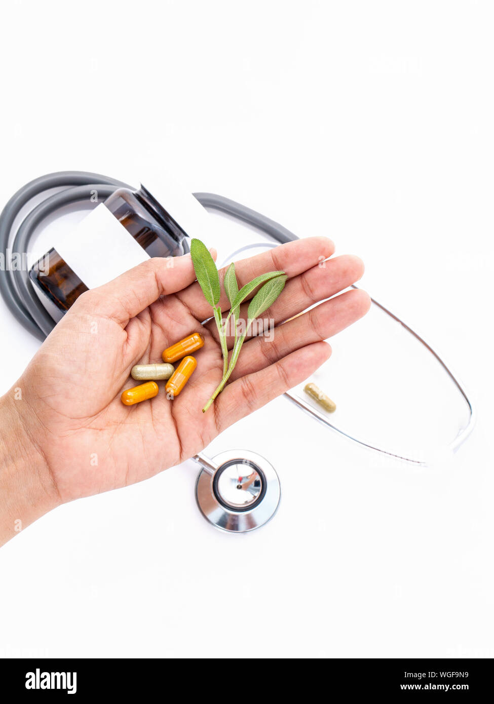 Hand holding capsules Cut Out Stock Images & Pictures - Alamy