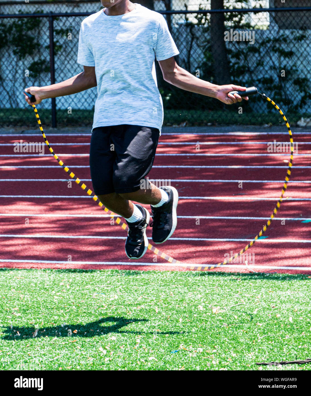 Boy skipping rope hi-res stock photography and images - Alamy