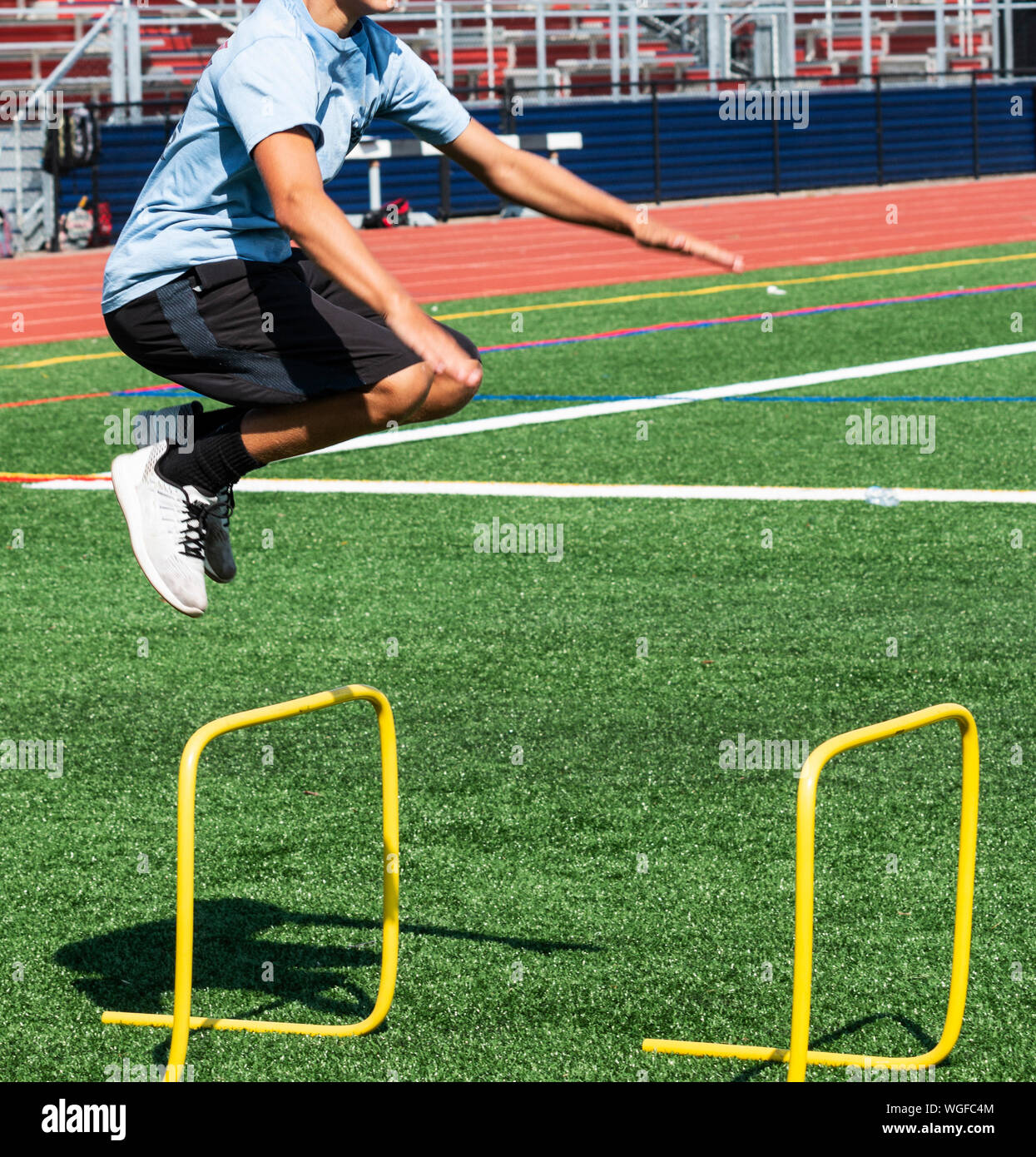 Boy running hurdles hi-res stock photography and images - Alamy