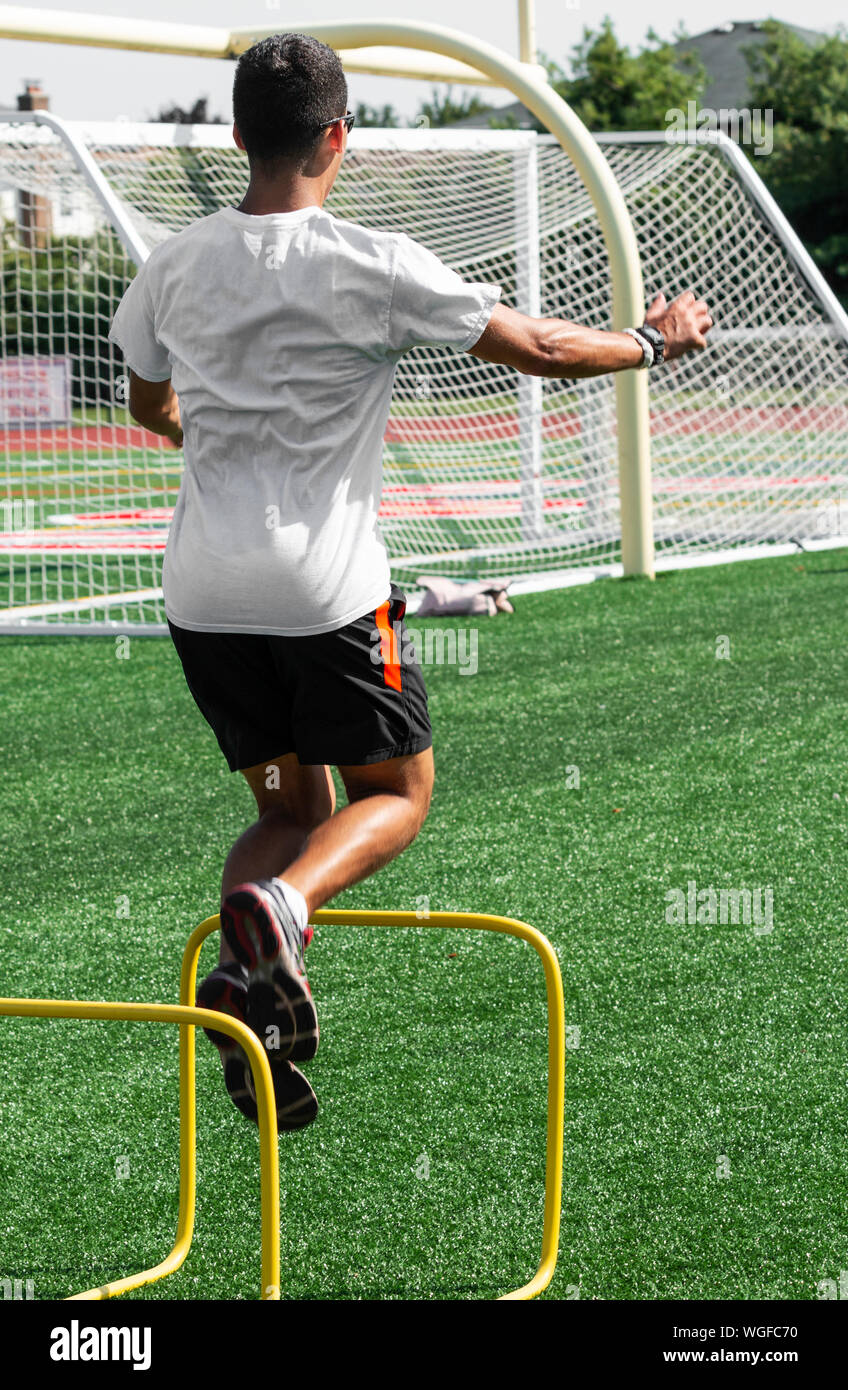 Boy running hurdles hi-res stock photography and images - Alamy